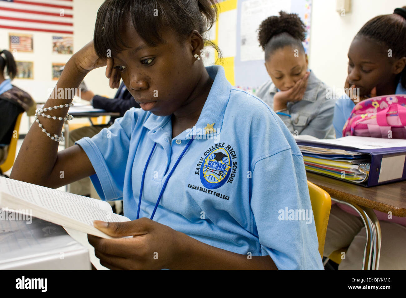 Dallas Texas: Black female student wears school uniform while reading ...