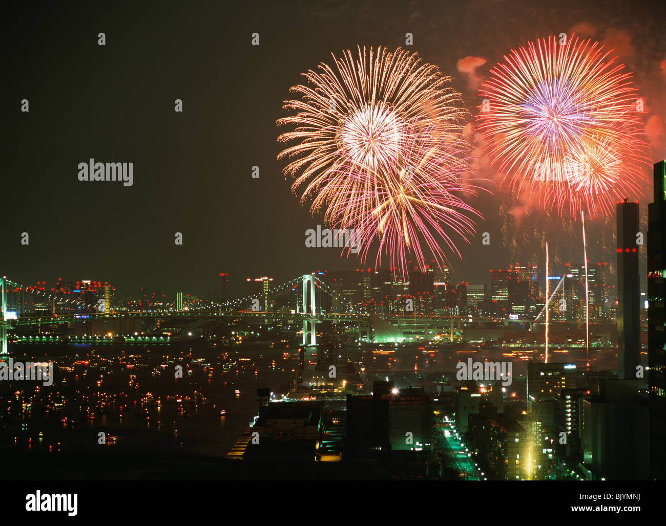 Firework display over city at night, Tokyo, Japan Stock Photo - Alamy