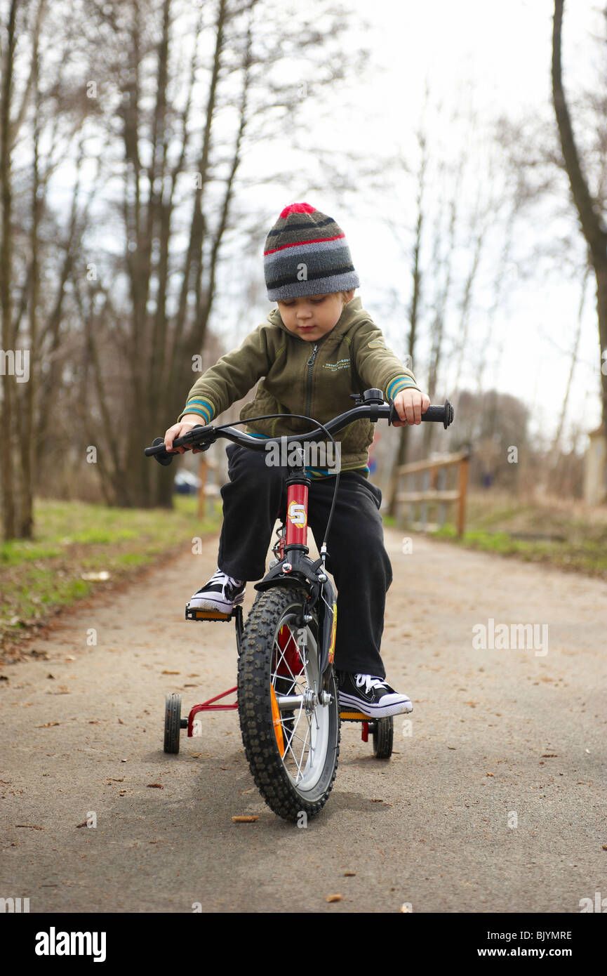 Boy Learning to Ride Bicycle Stock Photo - Alamy