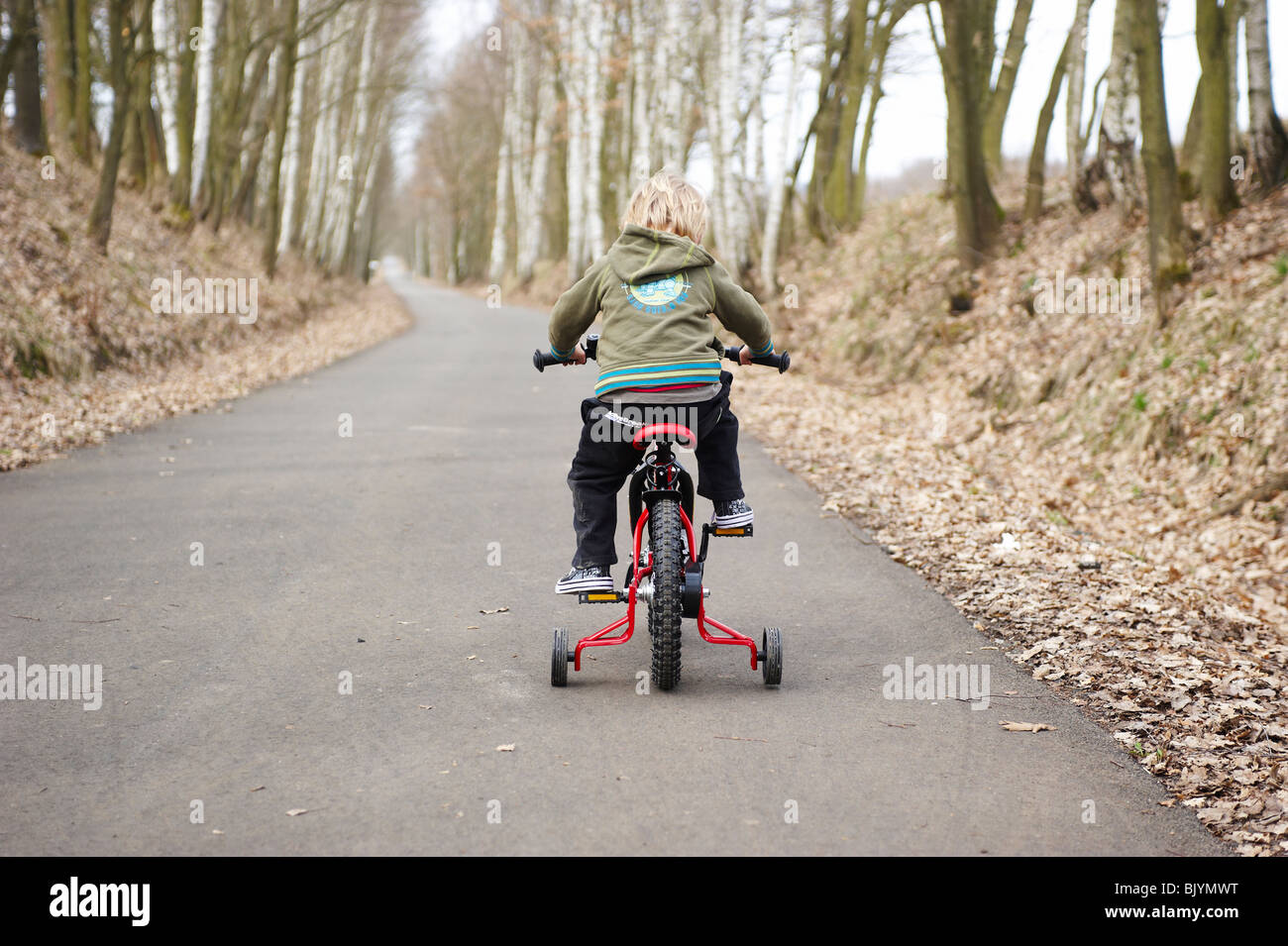 Boy Learning to Ride Bicycle Stock Photo - Alamy