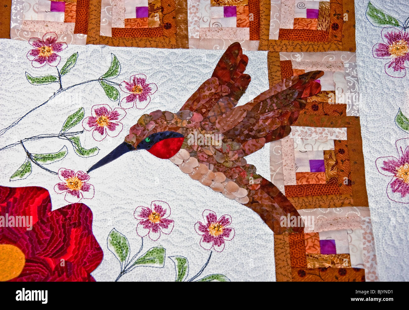 This image is of a hummingbird quilt hand stitched with beautiful ...