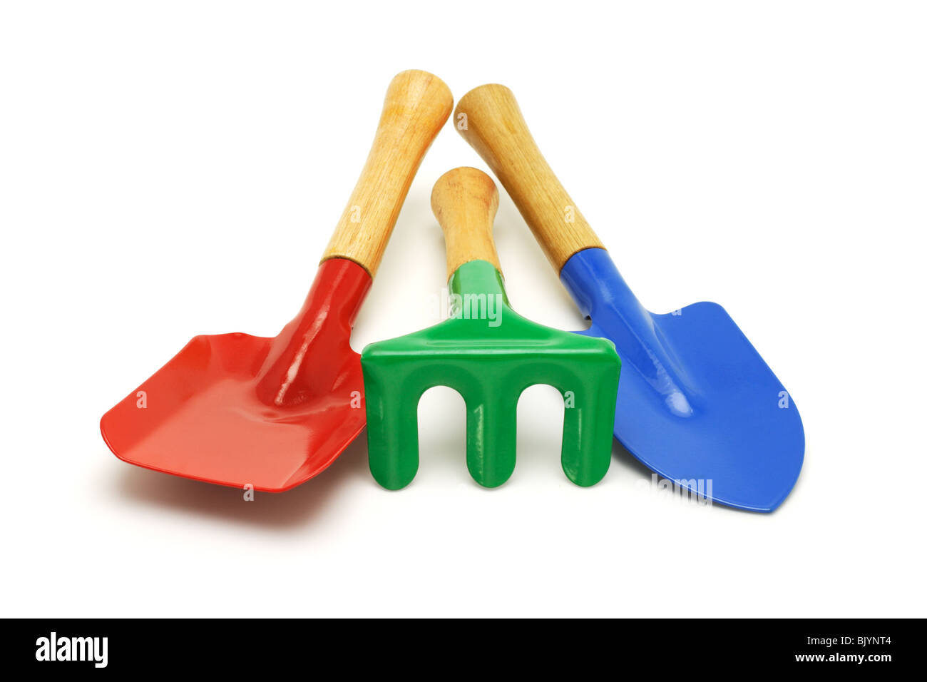 Colorful kids garden tools on white background Stock Photo - Alamy