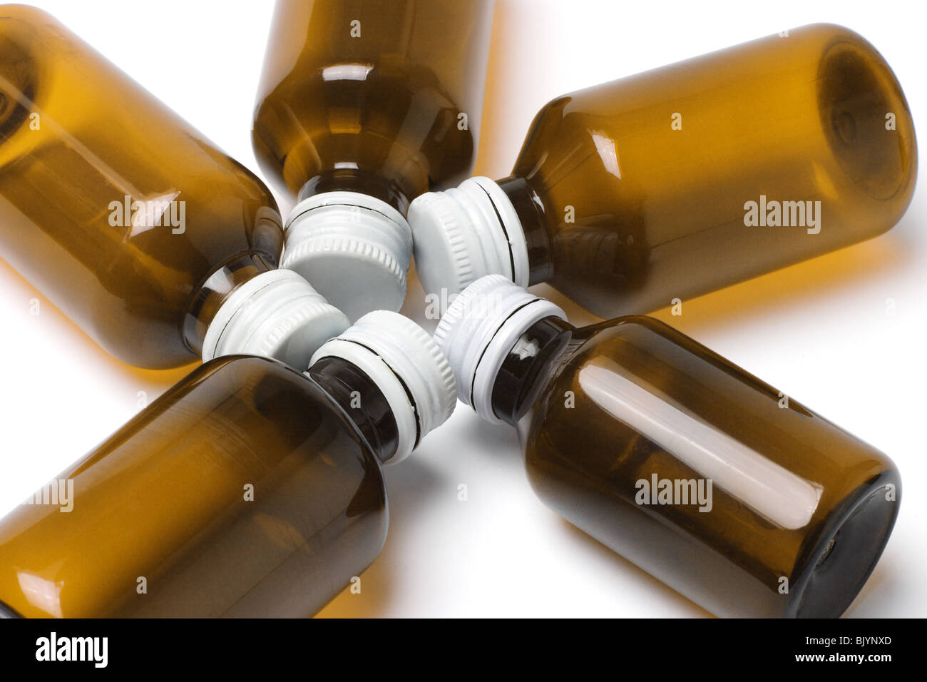 Used empty medicine bottles on white background Stock Photo - Alamy