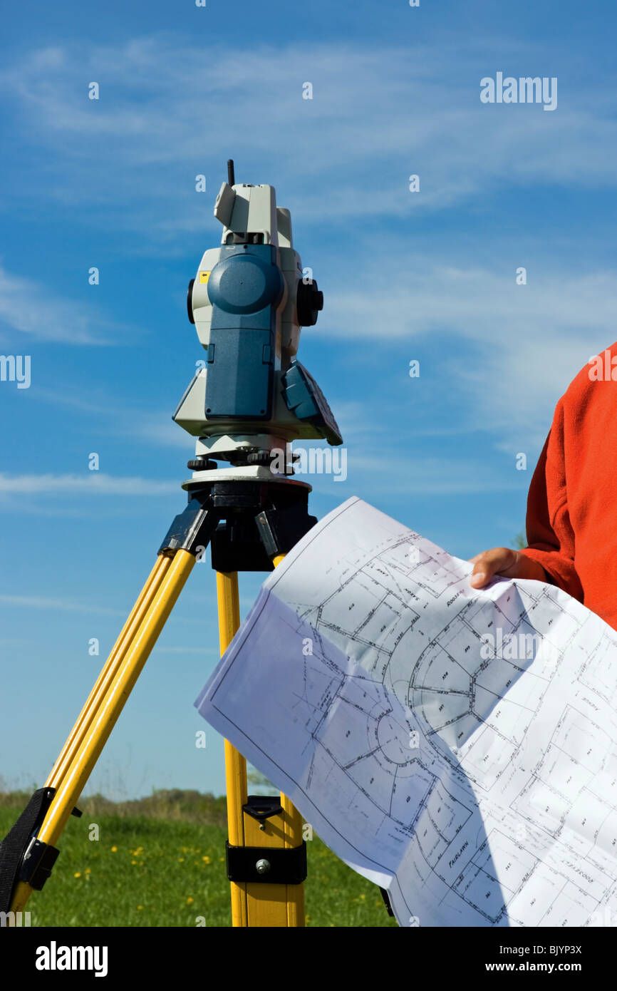 Theodolite and a map Stock Photo - Alamy