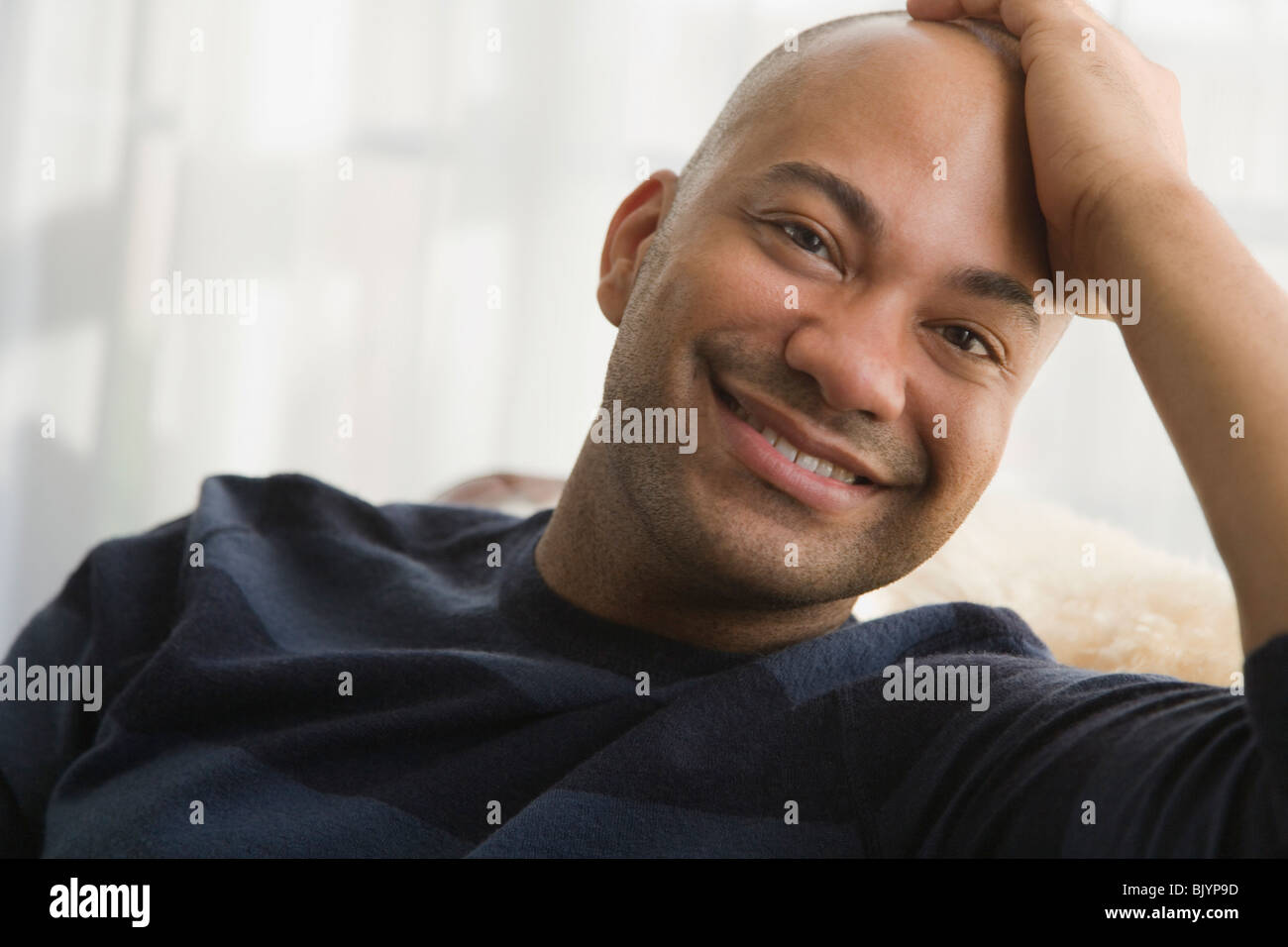 Mixed race man smiling Stock Photo - Alamy