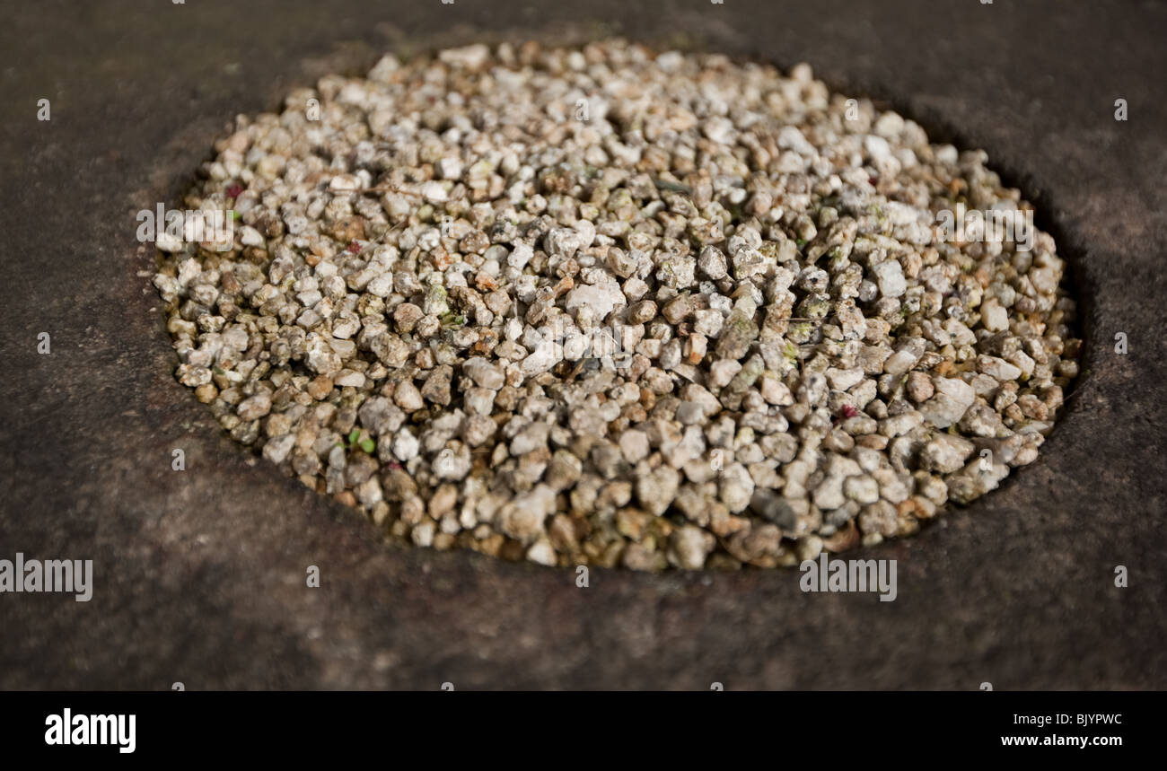 Circle of stones/pebbles on a larger stone/ rock Stock Photo - Alamy