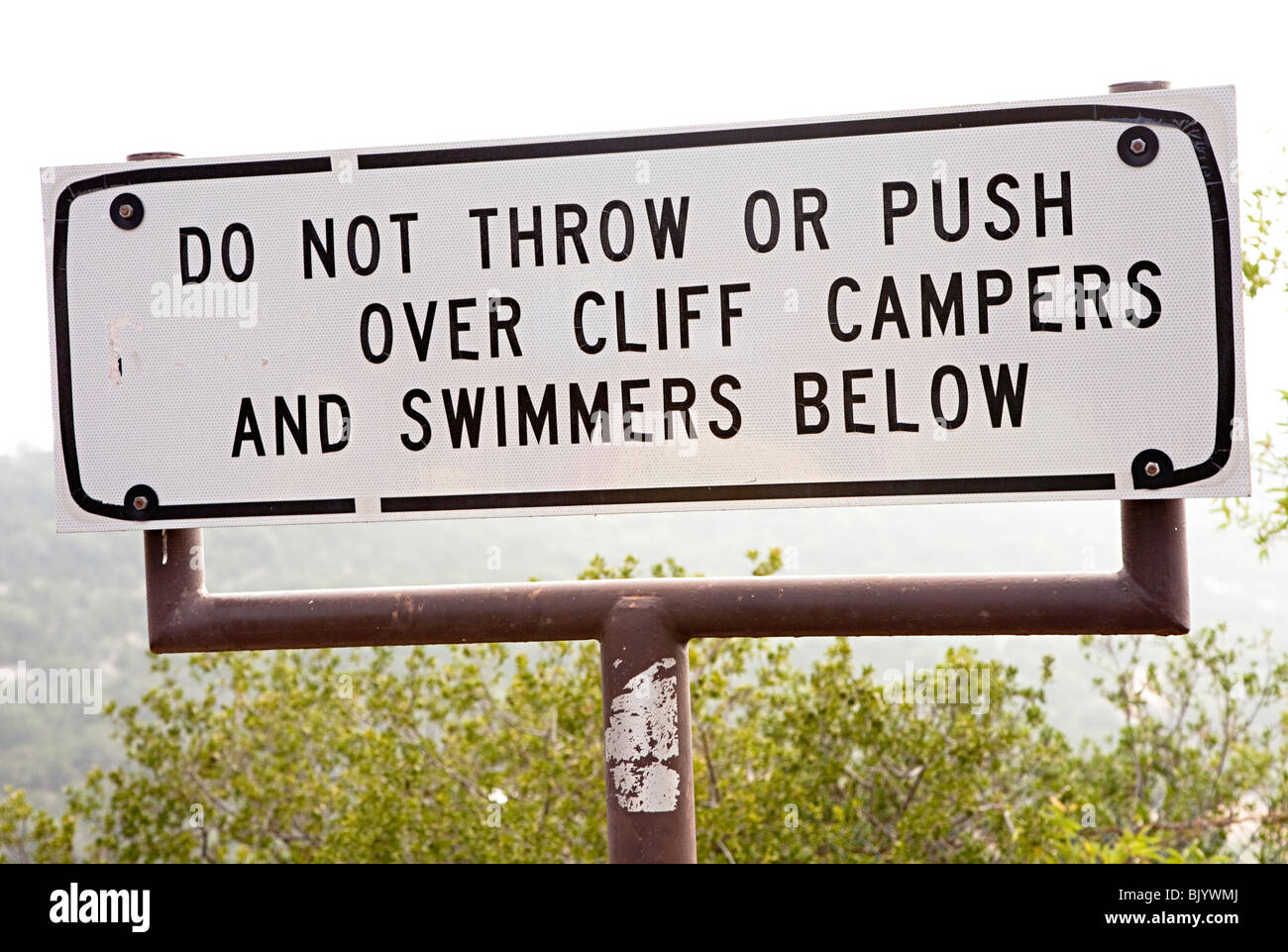 Sign at edge of cliff above river do not push or throw campers and ...