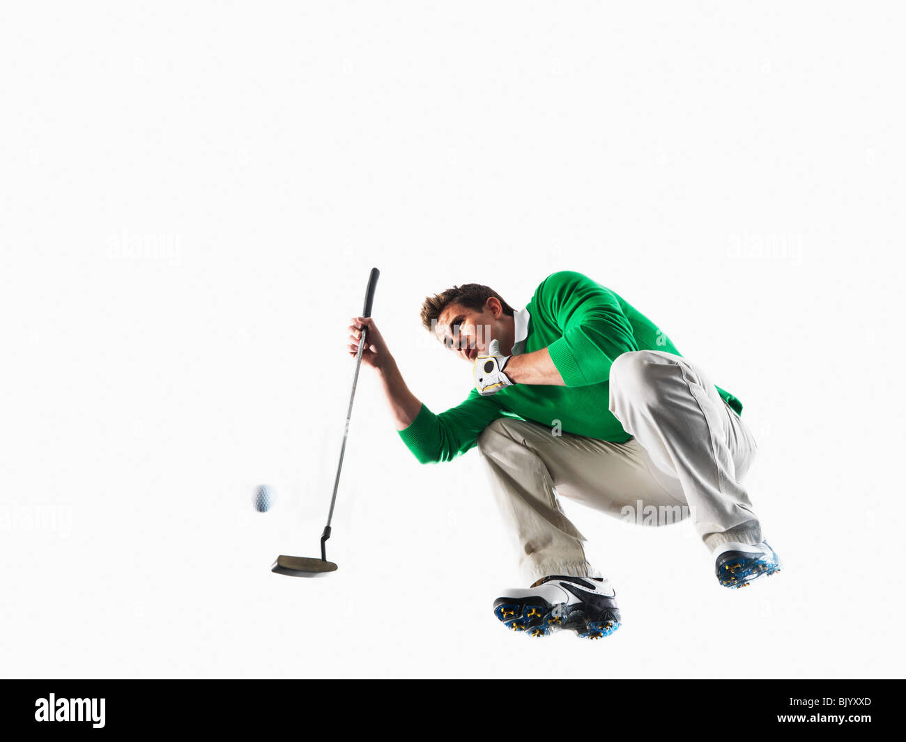 Man playing golf Stock Photo - Alamy