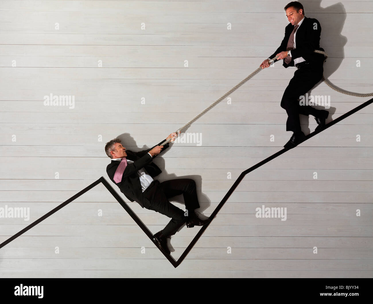 Business men climbing up graph Stock Photo - Alamy