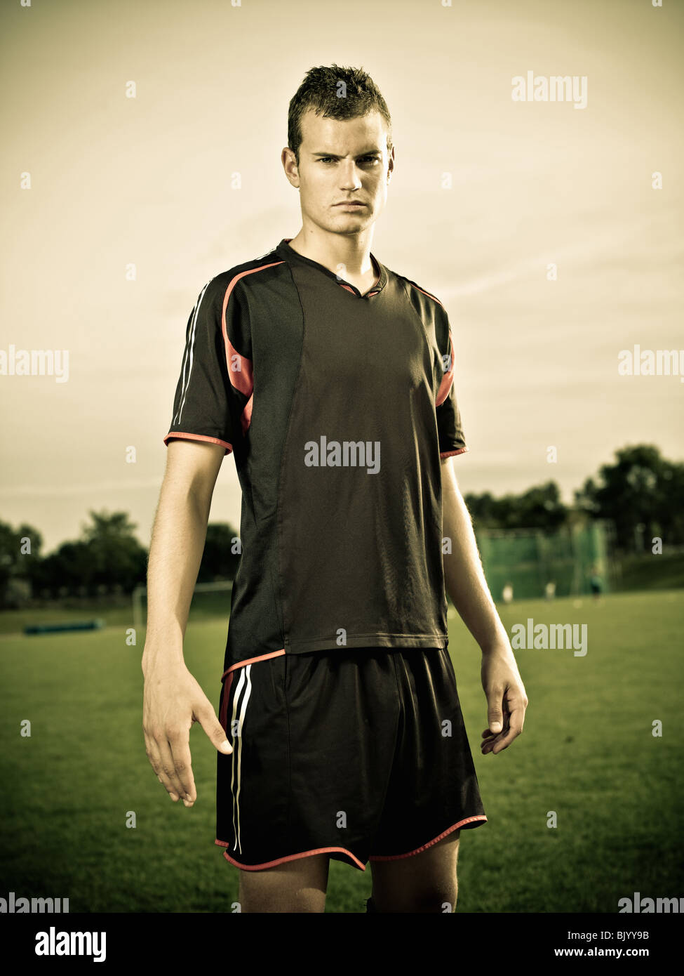 Young football player portrait Stock Photo - Alamy