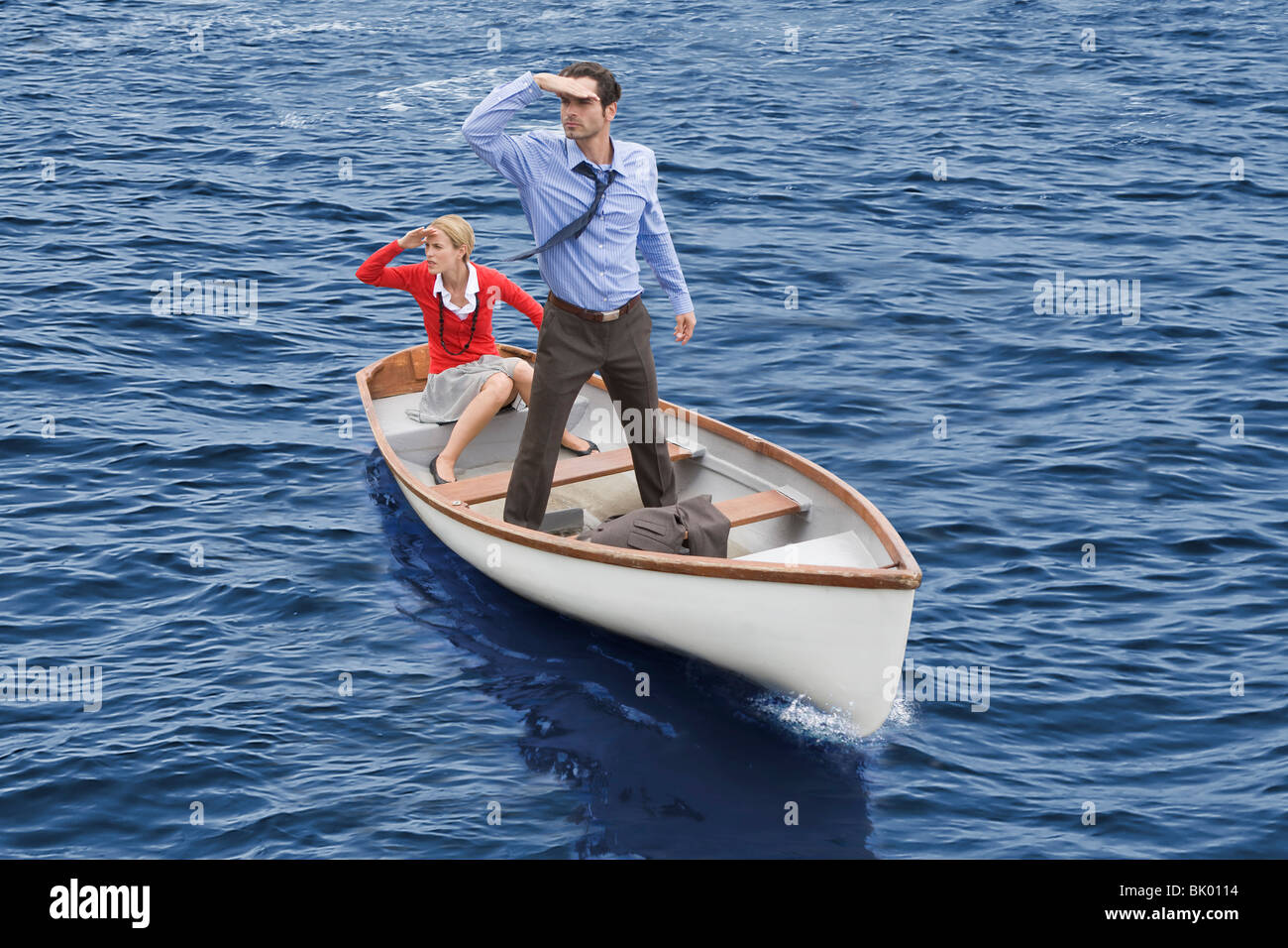 Couple looking out for help Stock Photo - Alamy