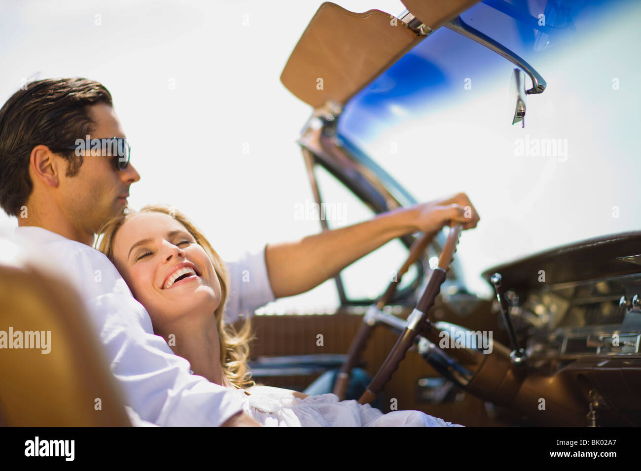 Young couple driving convertible Stock Photo - Alamy