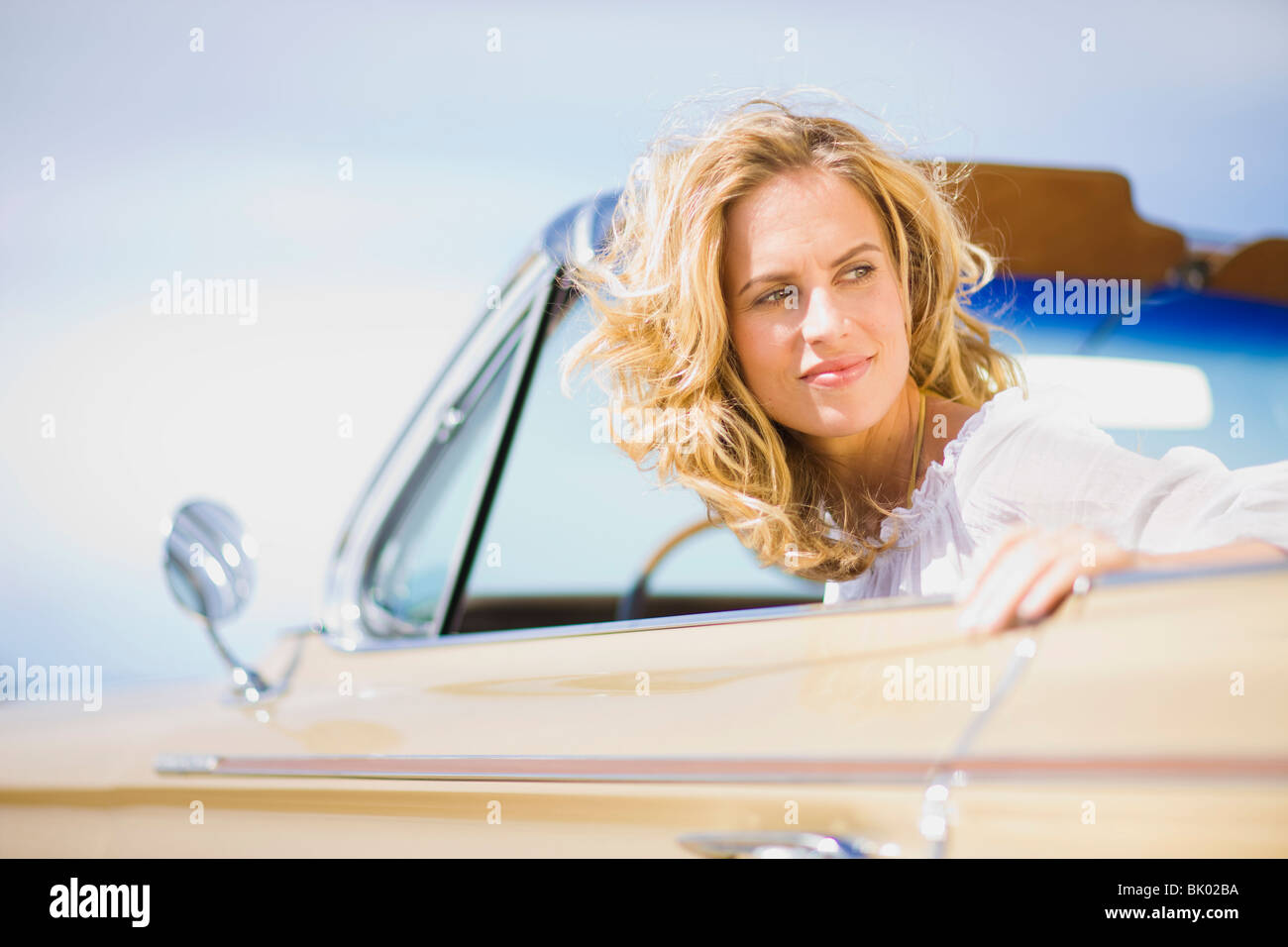Woman parking convertible Stock Photo - Alamy