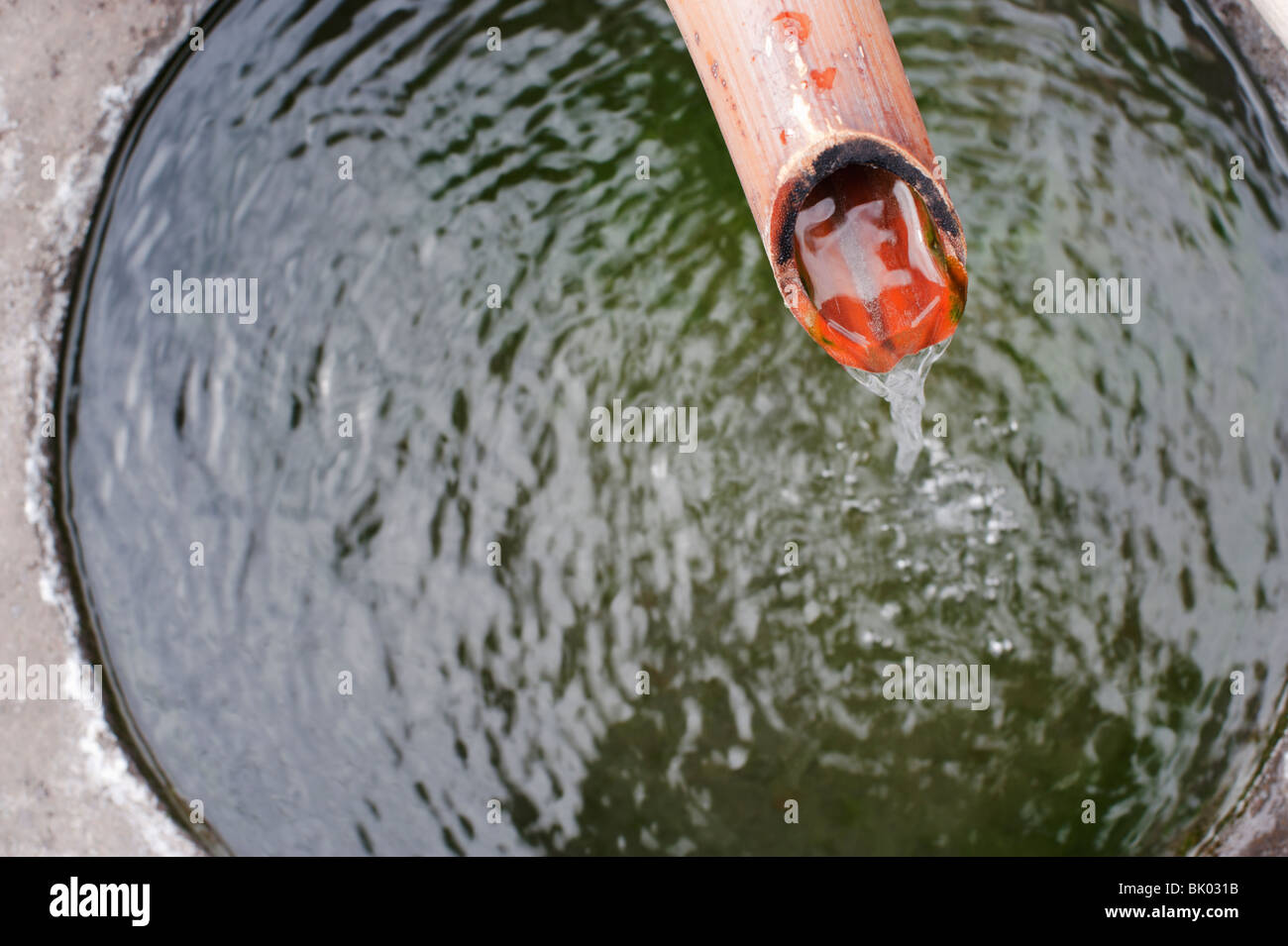 Onsen or hot spring water falls into basins from the Wata-no-yu spring ...
