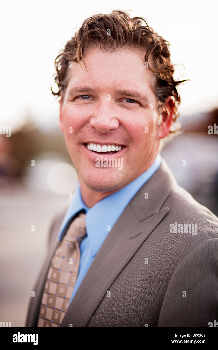 Portrait of smiling man in suit Stock Photo - Alamy