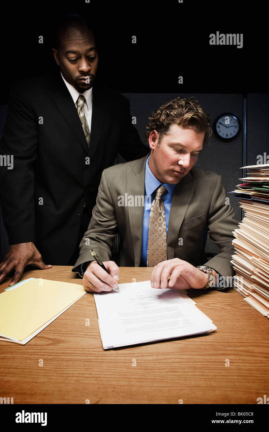Businessman leaning over cubicle hi-res stock photography and images ...