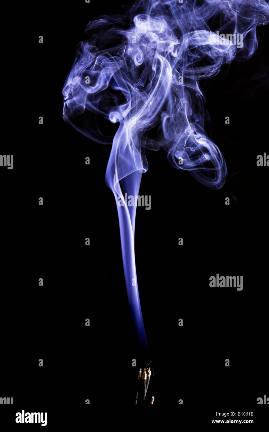 Incense smoke, abstract shape on black background Stock Photo - Alamy