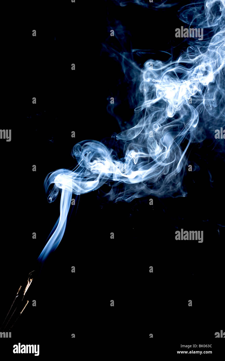 Incense smoke, abstract shape on black background Stock Photo - Alamy