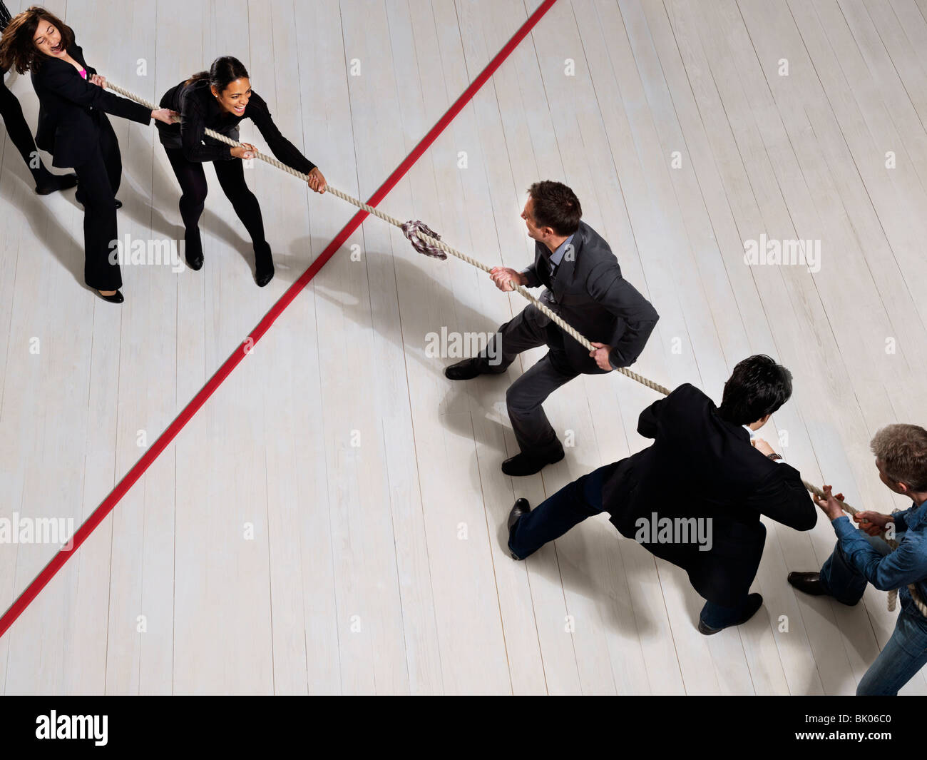 Multi ethnic group playing tug of war hi-res stock photography and ...
