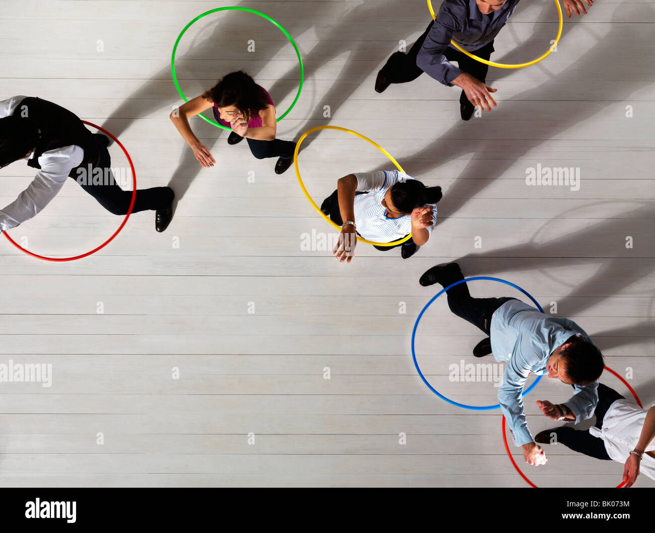 Men and women with hula hoops Stock Photo - Alamy