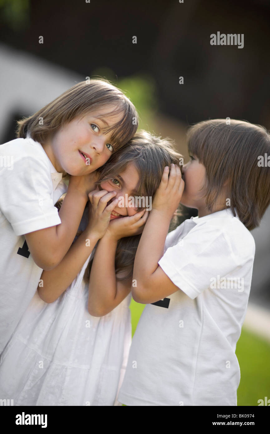 Children having a secret Stock Photo - Alamy