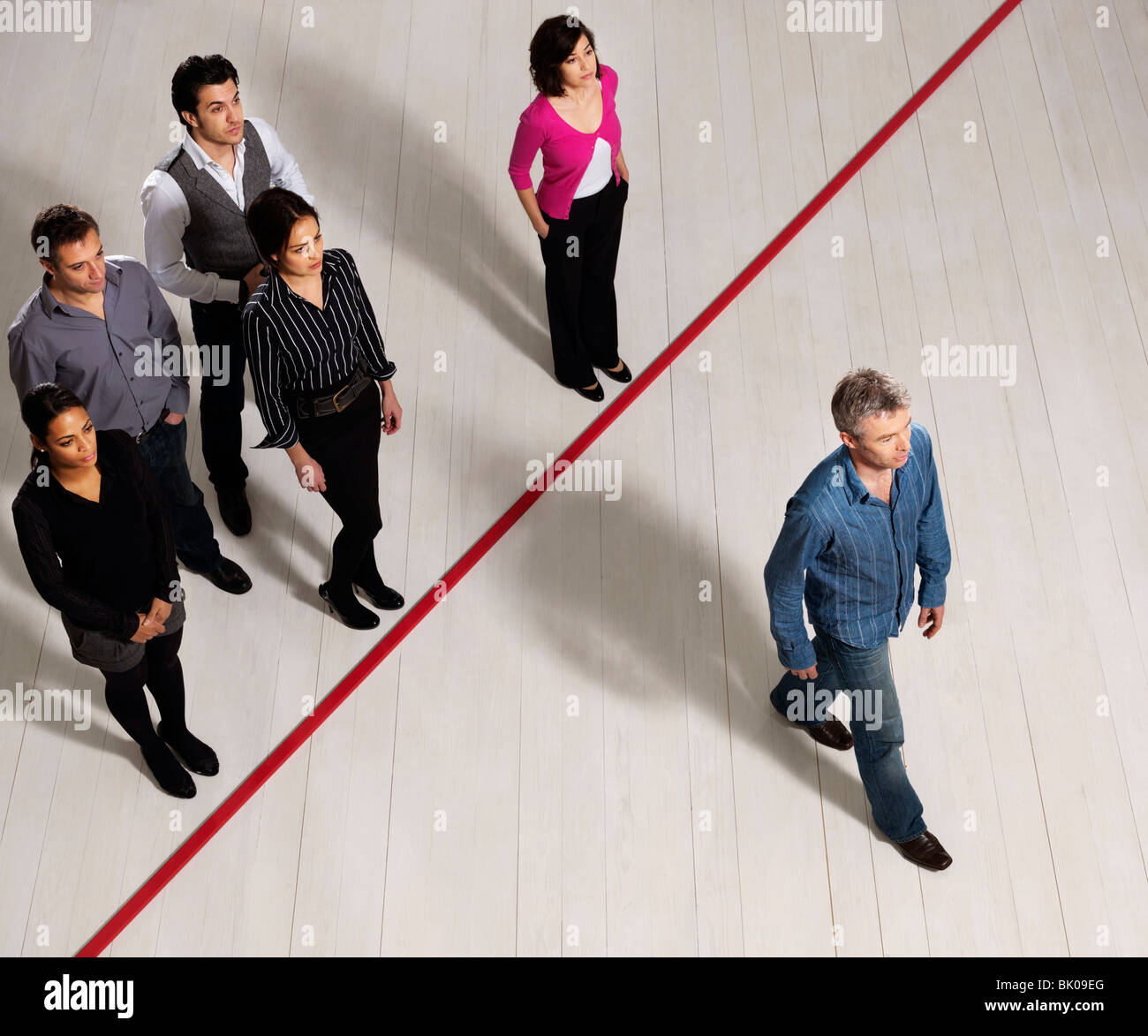 Business men and women crossing red line Stock Photo - Alamy