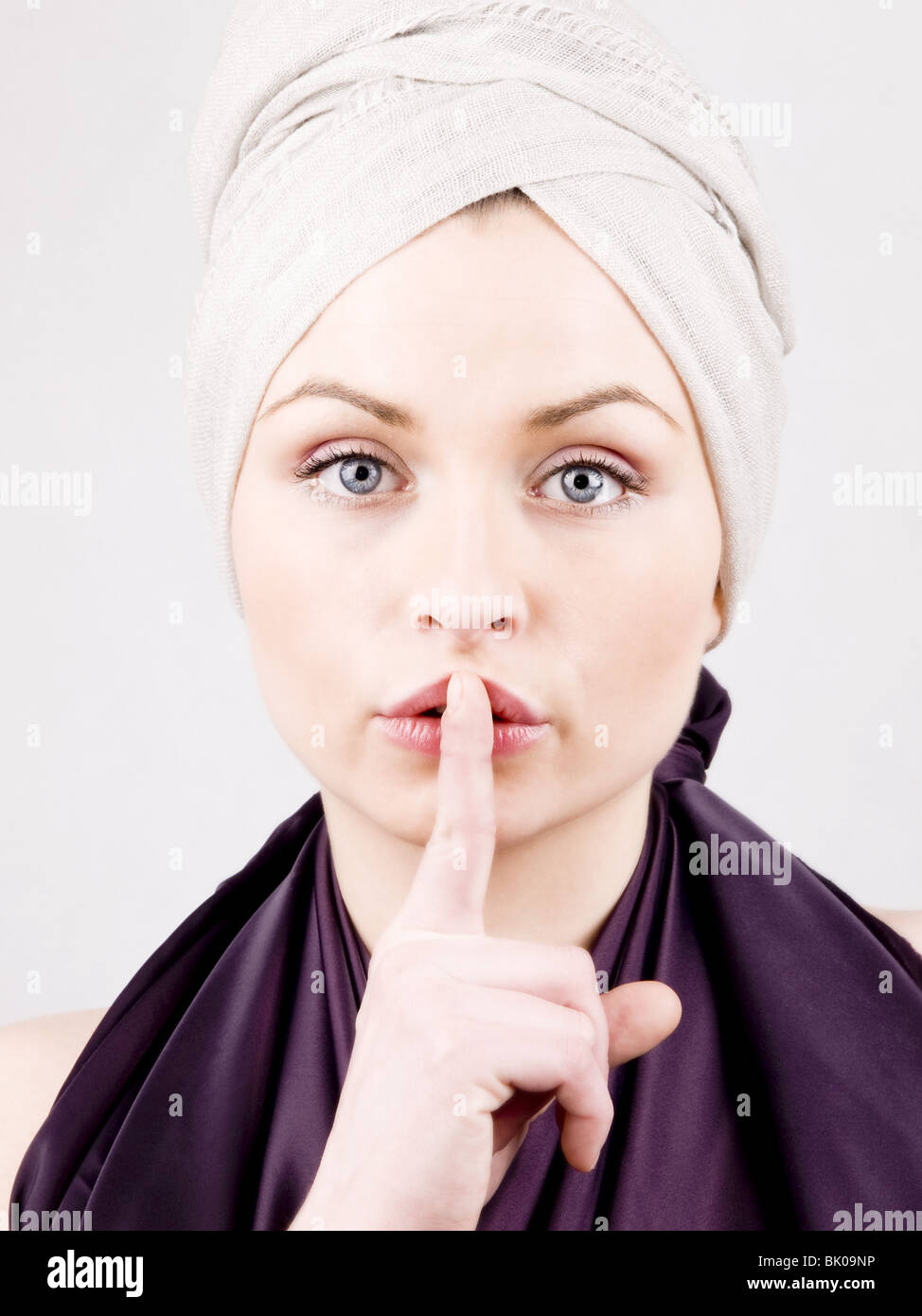 Portrait of beautiful young woman, showing gesture of silence Stock ...