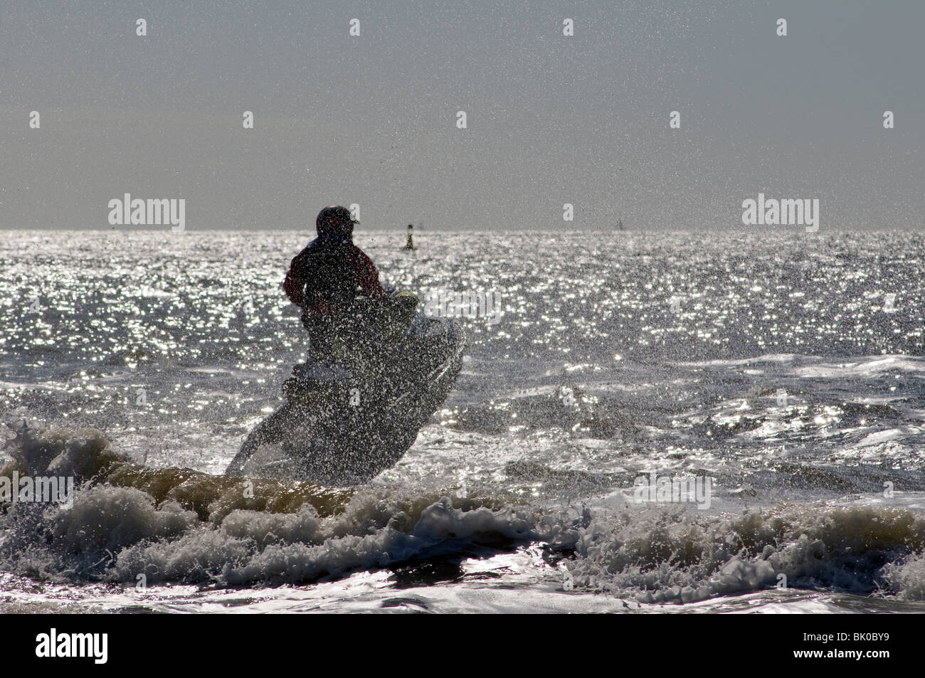Jet skiing off the beach in Bournemouth, jumping the surf and having ...