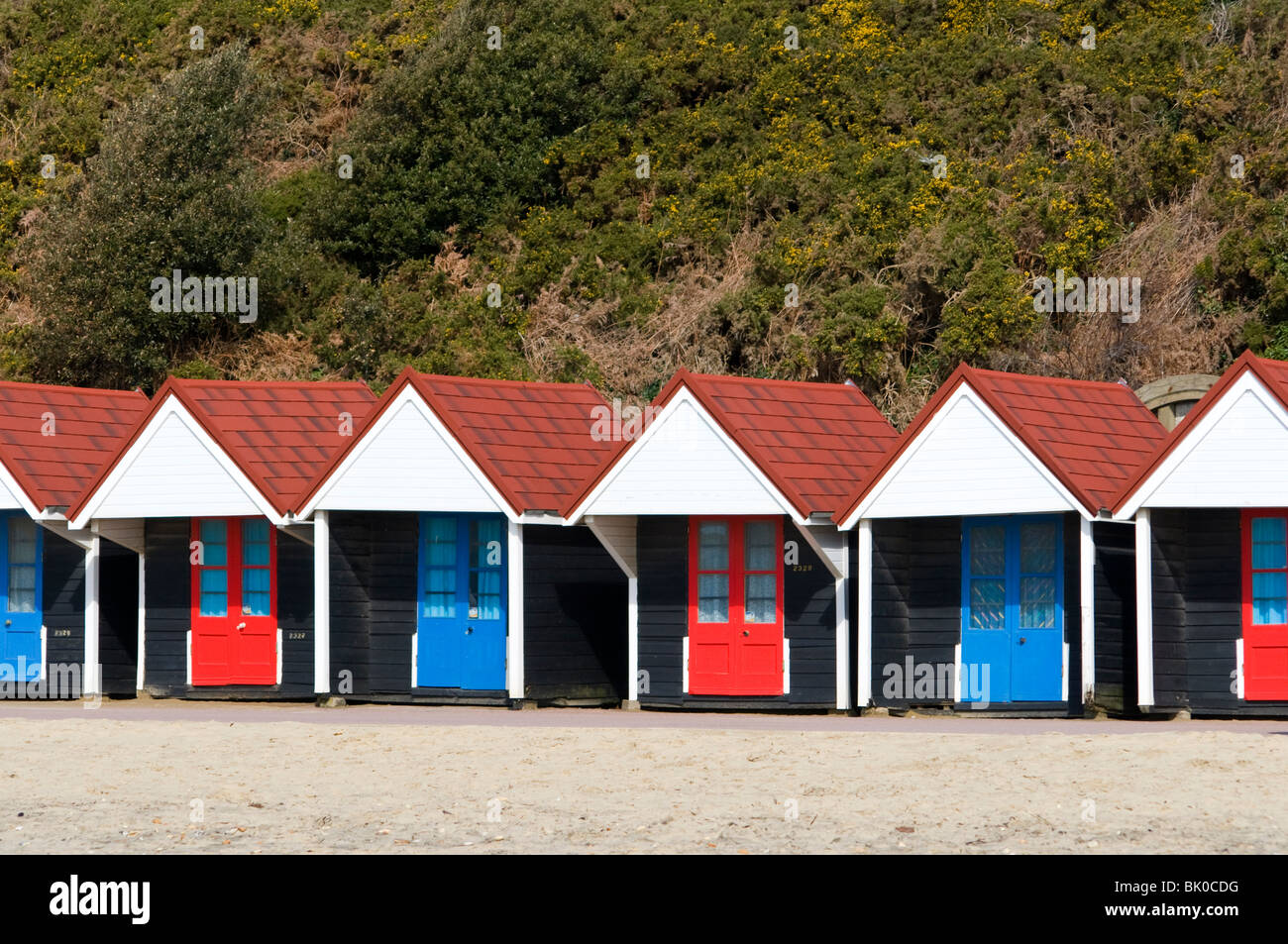 colourful beach huts in Bournemouth with sunshine Stock Photo - Alamy