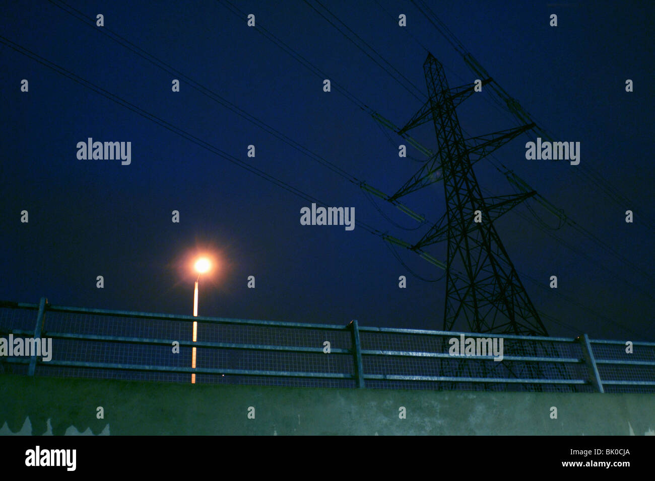 Pylon and light Stock Photo - Alamy