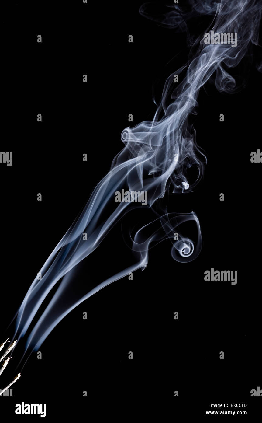 Incense smoke, abstract shape on black background Stock Photo - Alamy