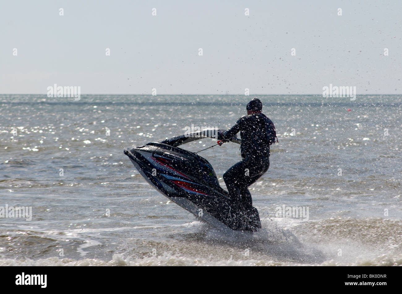 Jet skiing off the beach in Bournemouth, jumping the surf and having ...