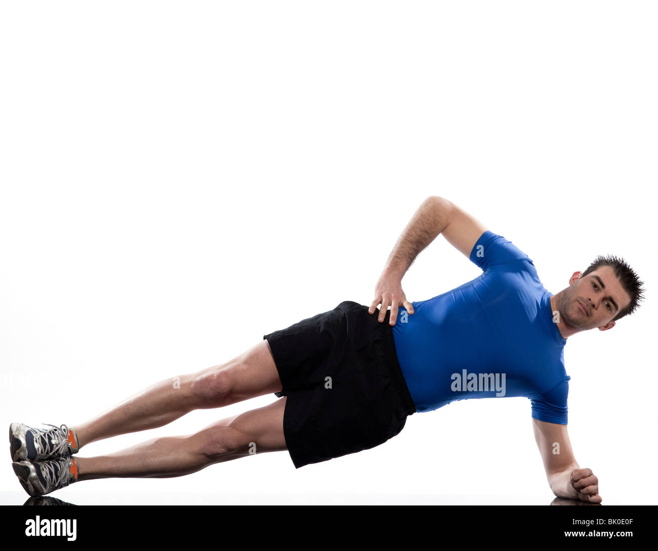 man lying on side Abdominals workout posture on studio isolated white ...