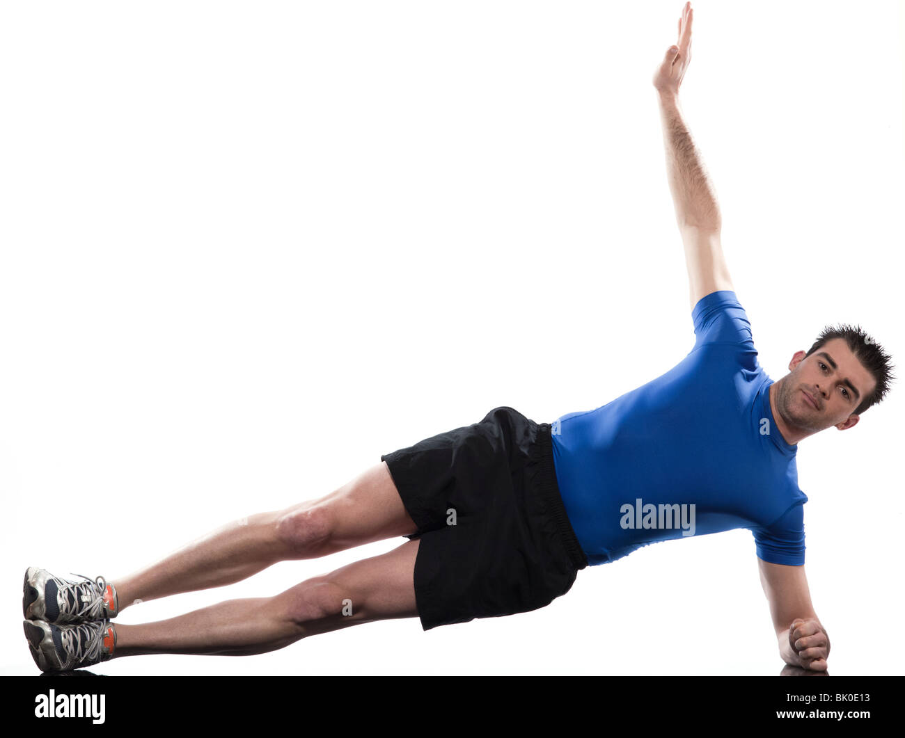 man lying on side Abdominals workout posture on studio isolated white ...
