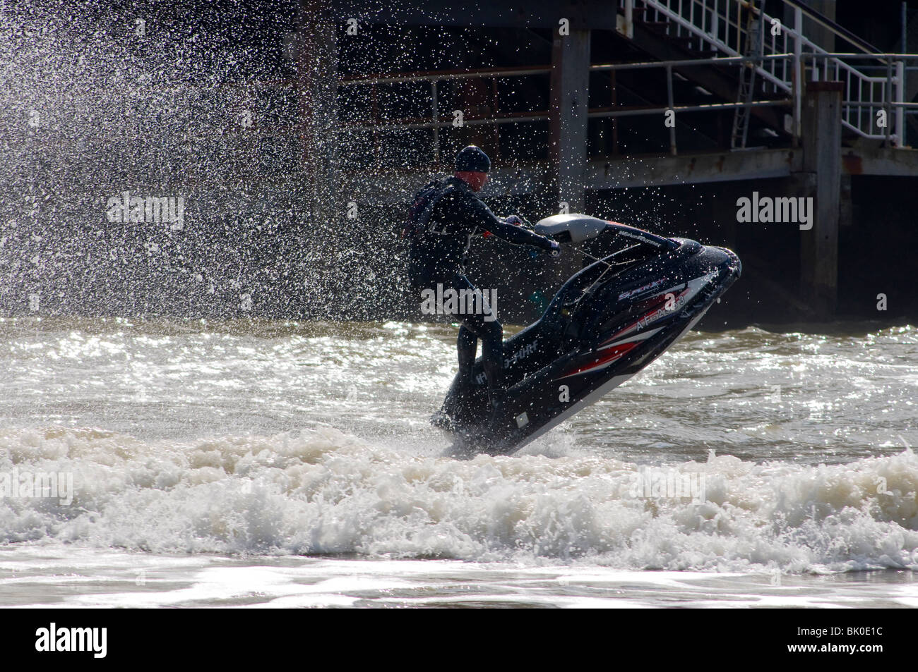 Jet skiing off the beach in Bournemouth, jumping the surf and having ...