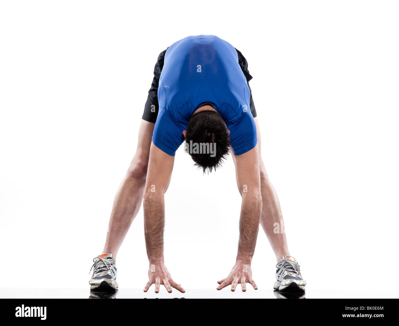 stretching workout posture by a man on studio white background Stock ...