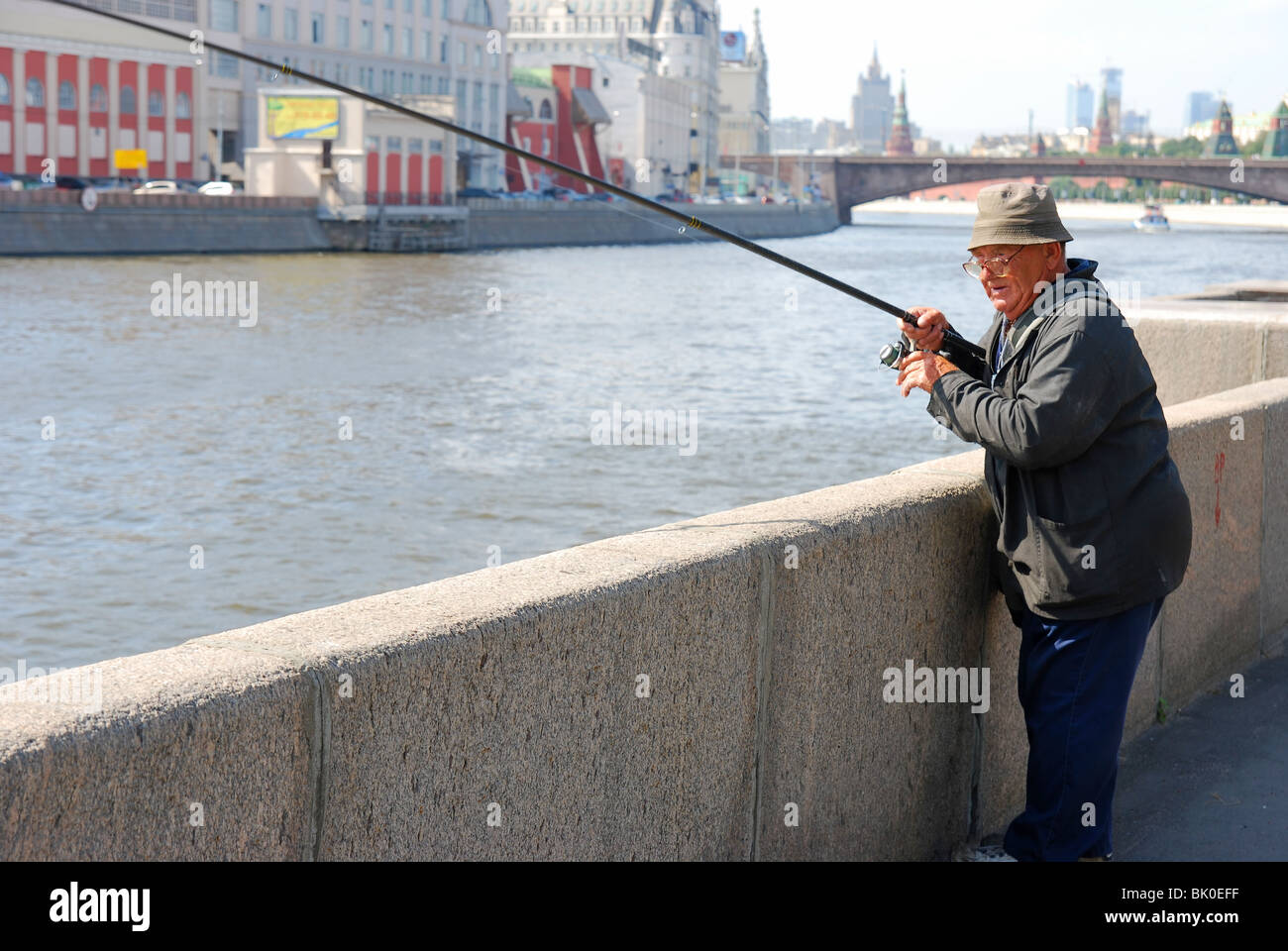 Old fisherman catching fish in Moscow Stock Photo - Alamy
