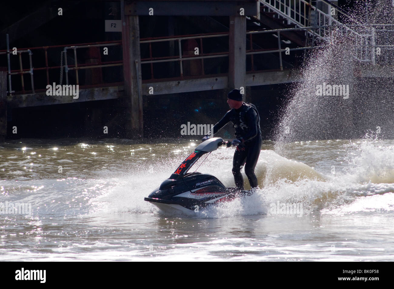 Jet skiing off the beach in Bournemouth, jumping the surf and having ...