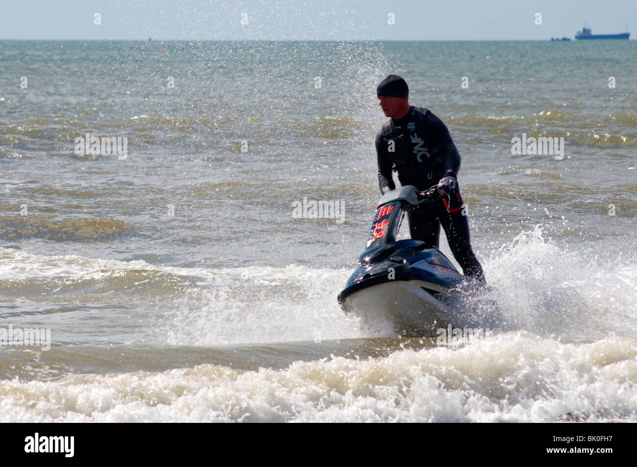 Jet skiing off the beach in Bournemouth, jumping the surf and having ...
