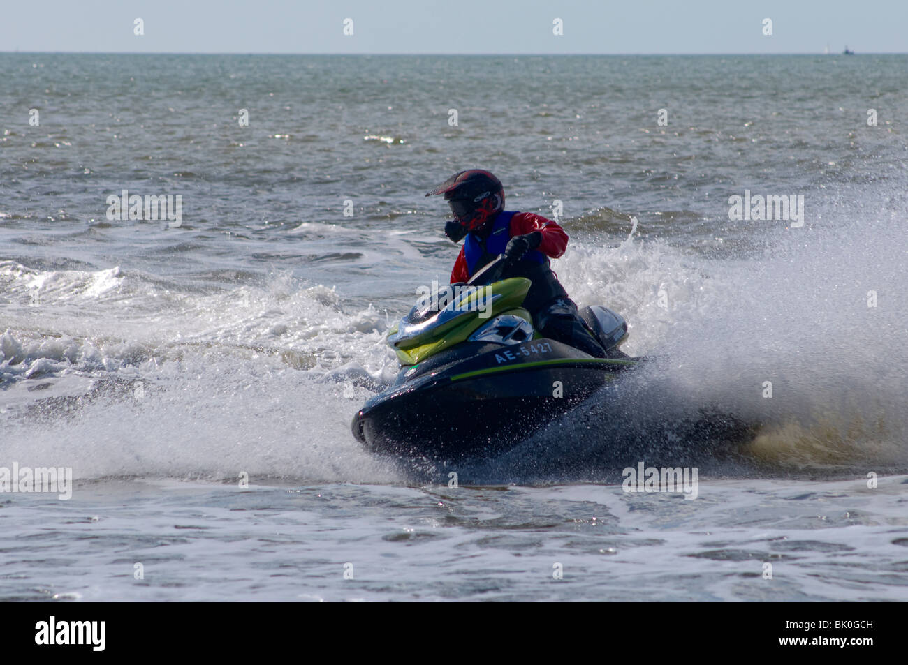 Jet skiing off the beach in Bournemouth, jumping the surf and having ...