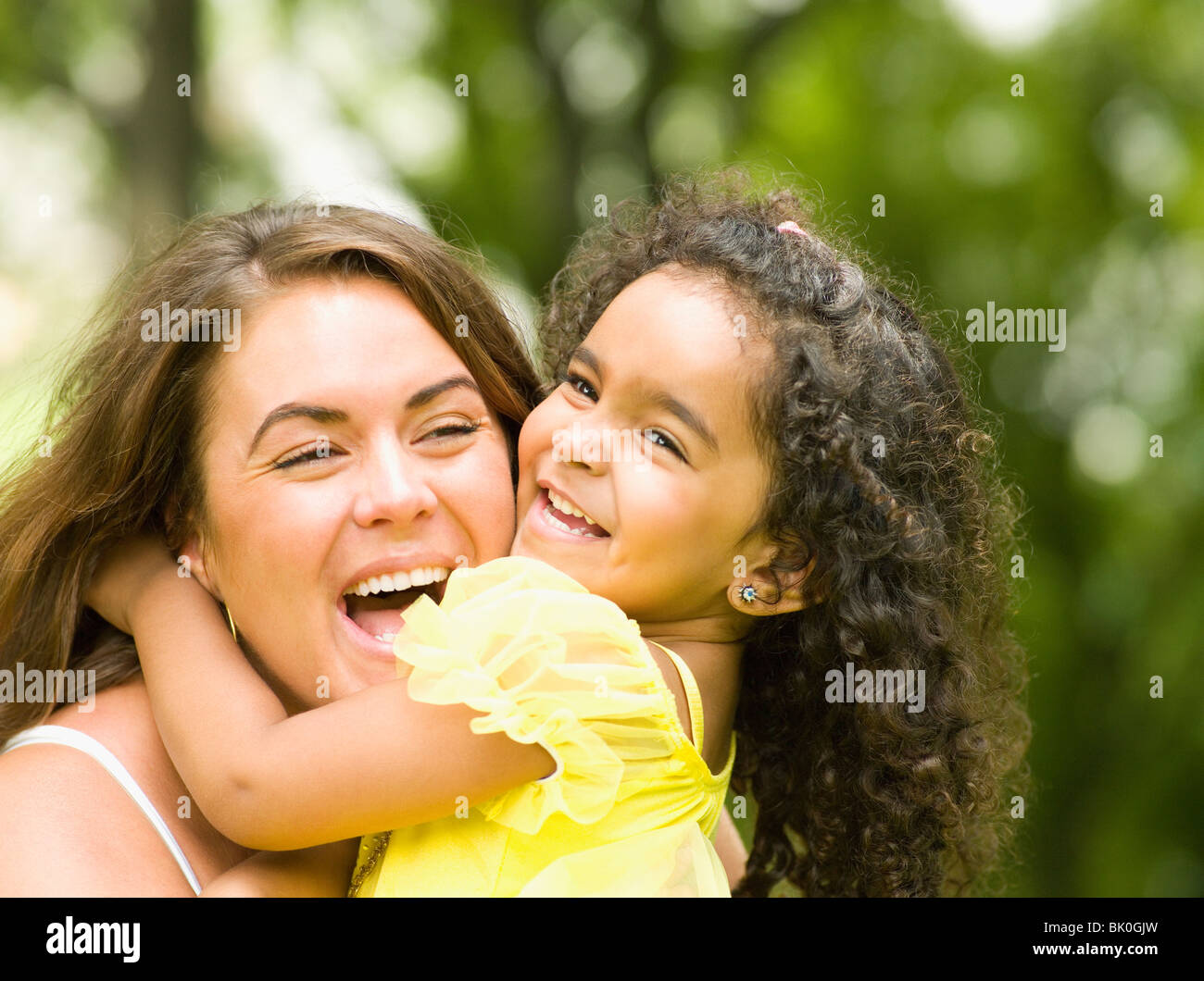 Daughter hugging mother Stock Photo - Alamy