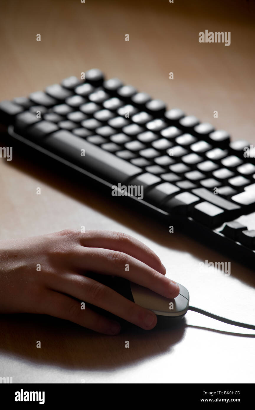 Childs hand operating a computer mouse Stock Photo - Alamy