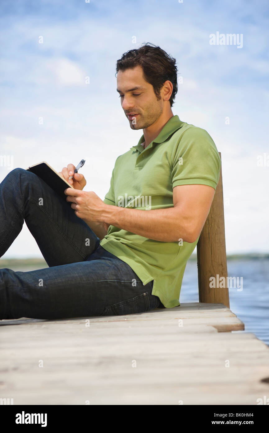 Man writing a letter Stock Photo - Alamy