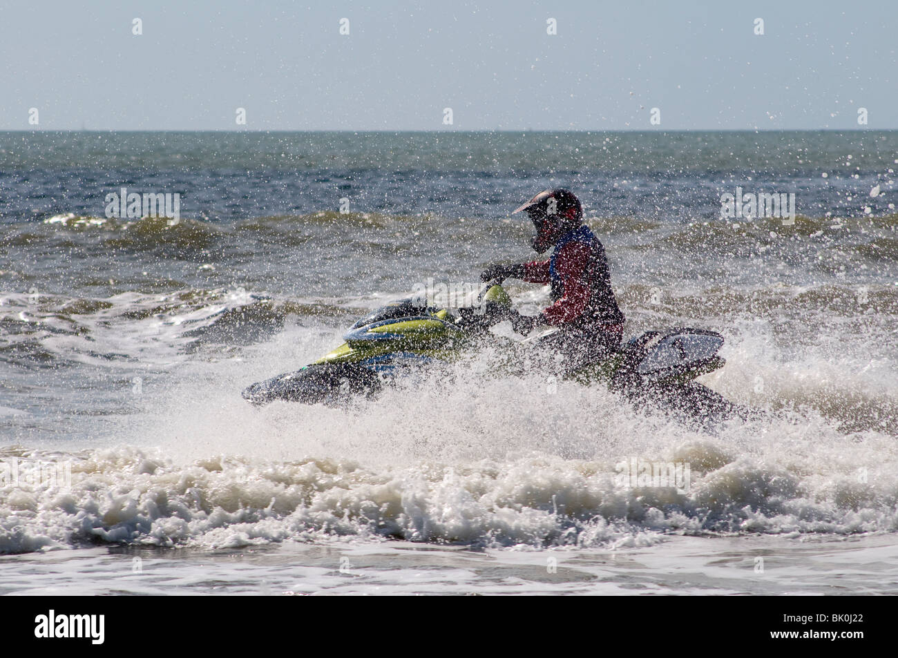 Jet skiing off the beach in Bournemouth, jumping the surf and having ...