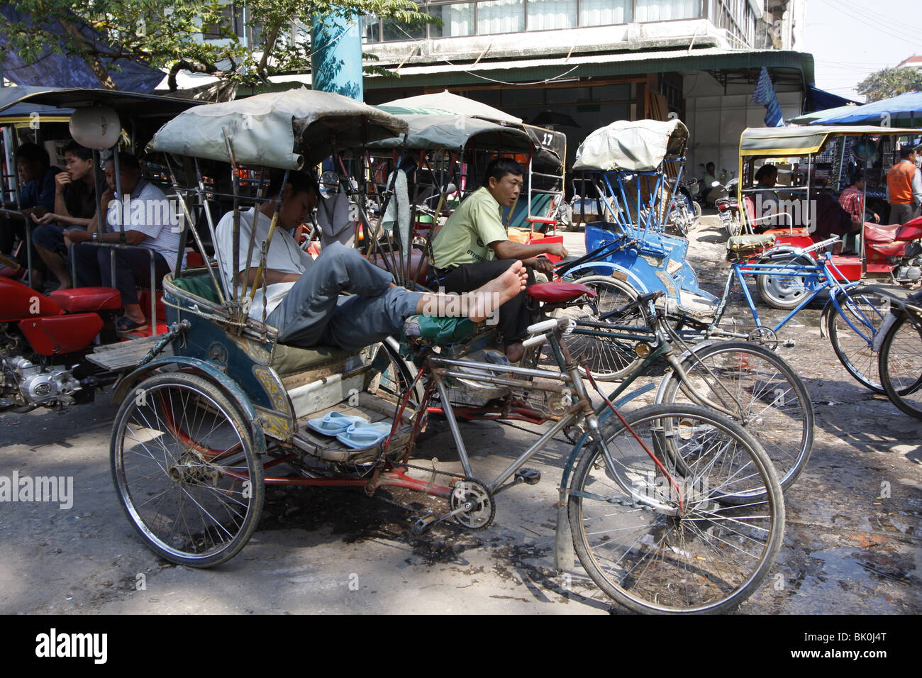 Rickshaw drivers wait for customers in Tachilek, Burma, Myanmar Stock ...