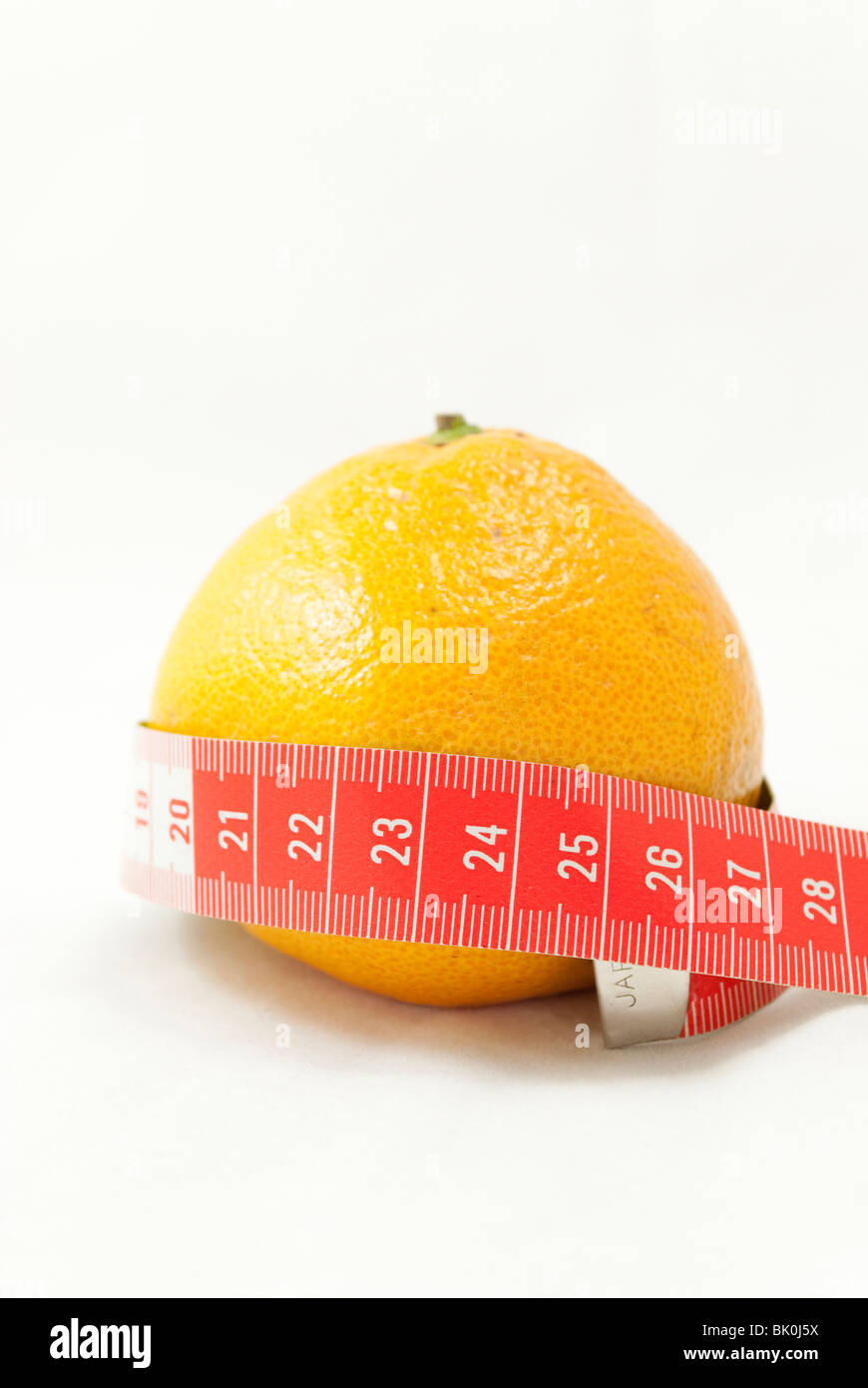 Mandarin with tape measure Stock Photo - Alamy