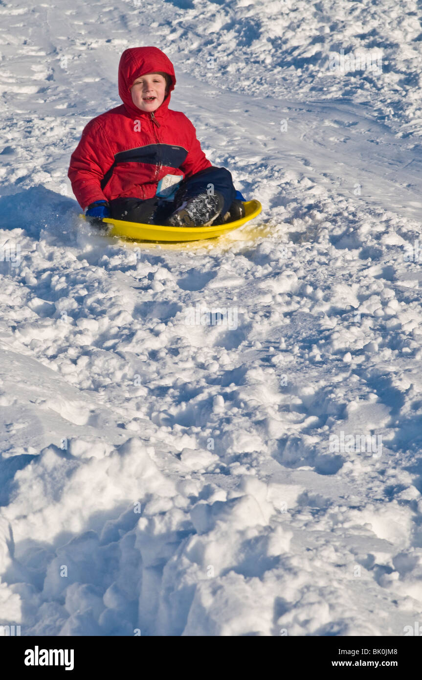 Young families children sleds on snowy city park hillside Stock Photo ...
