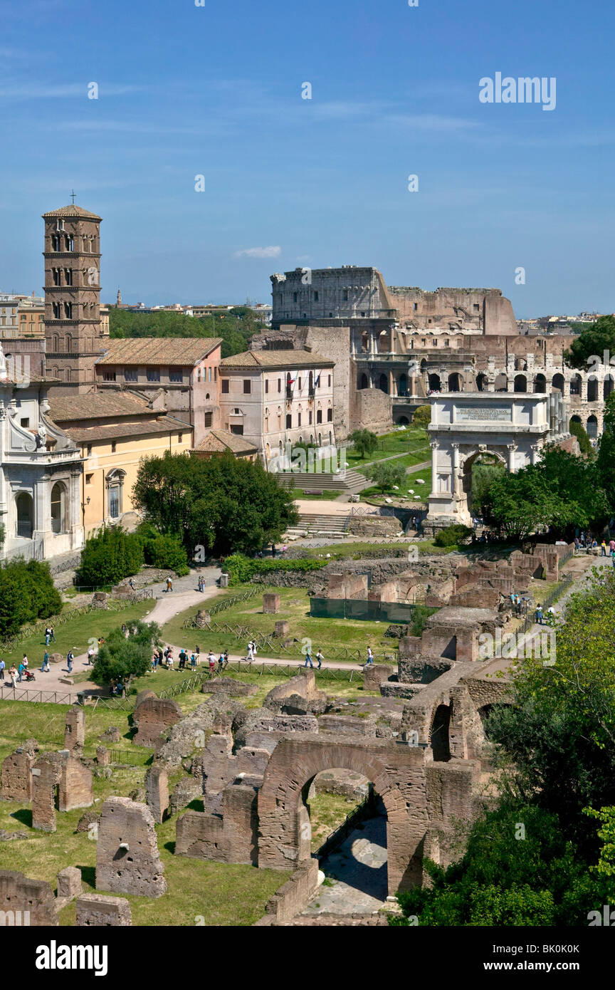 Portrait view of the ruins of the Roman Forum with the Colosseum in the ...