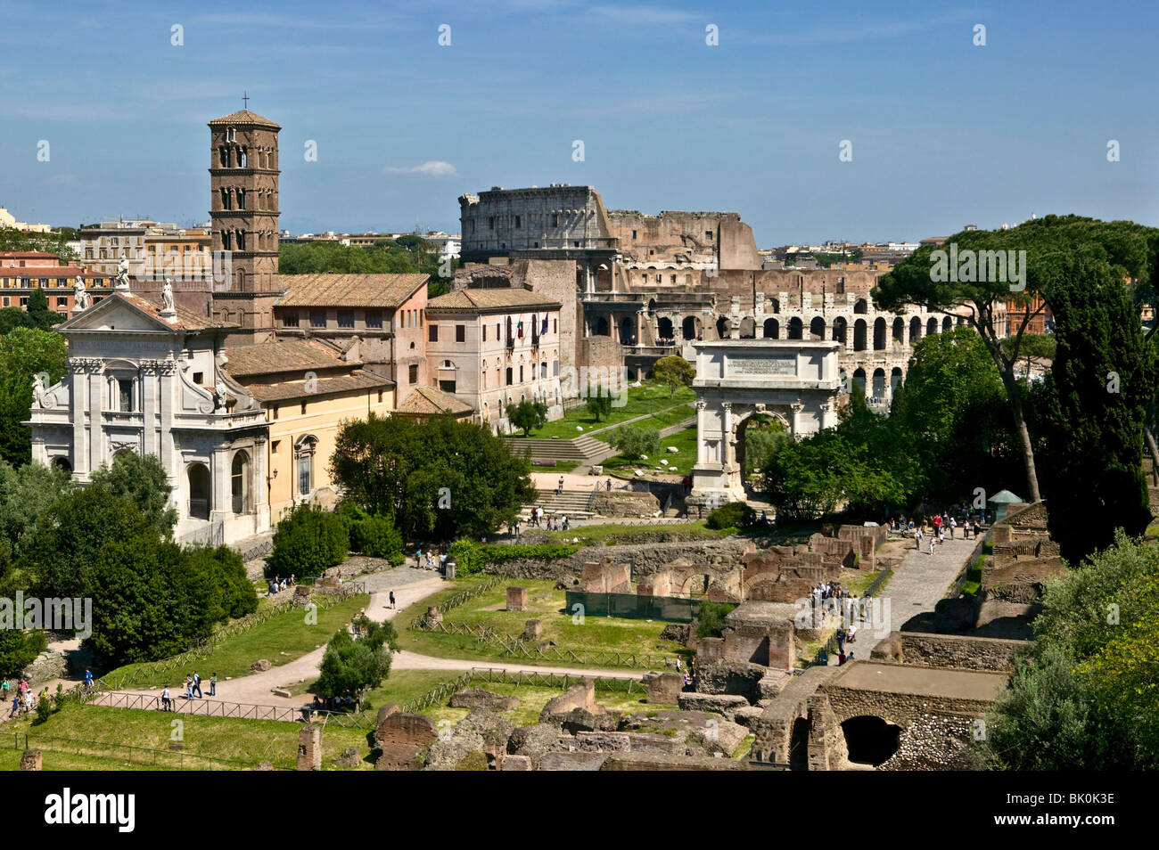 Landscape view of the ruins of the Roman Forum with the Colosseum in ...