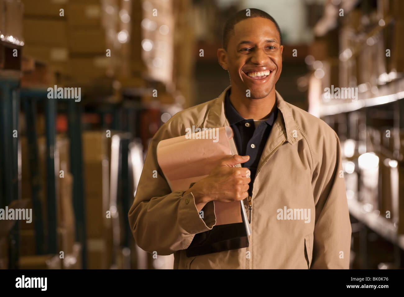 Black man working in warehouse Stock Photo - Alamy